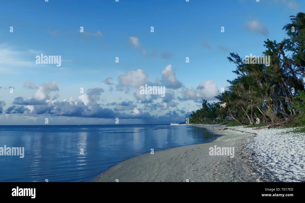 Beautiful beach with white fluffy cottony clouds in Garapan, Saipan ...