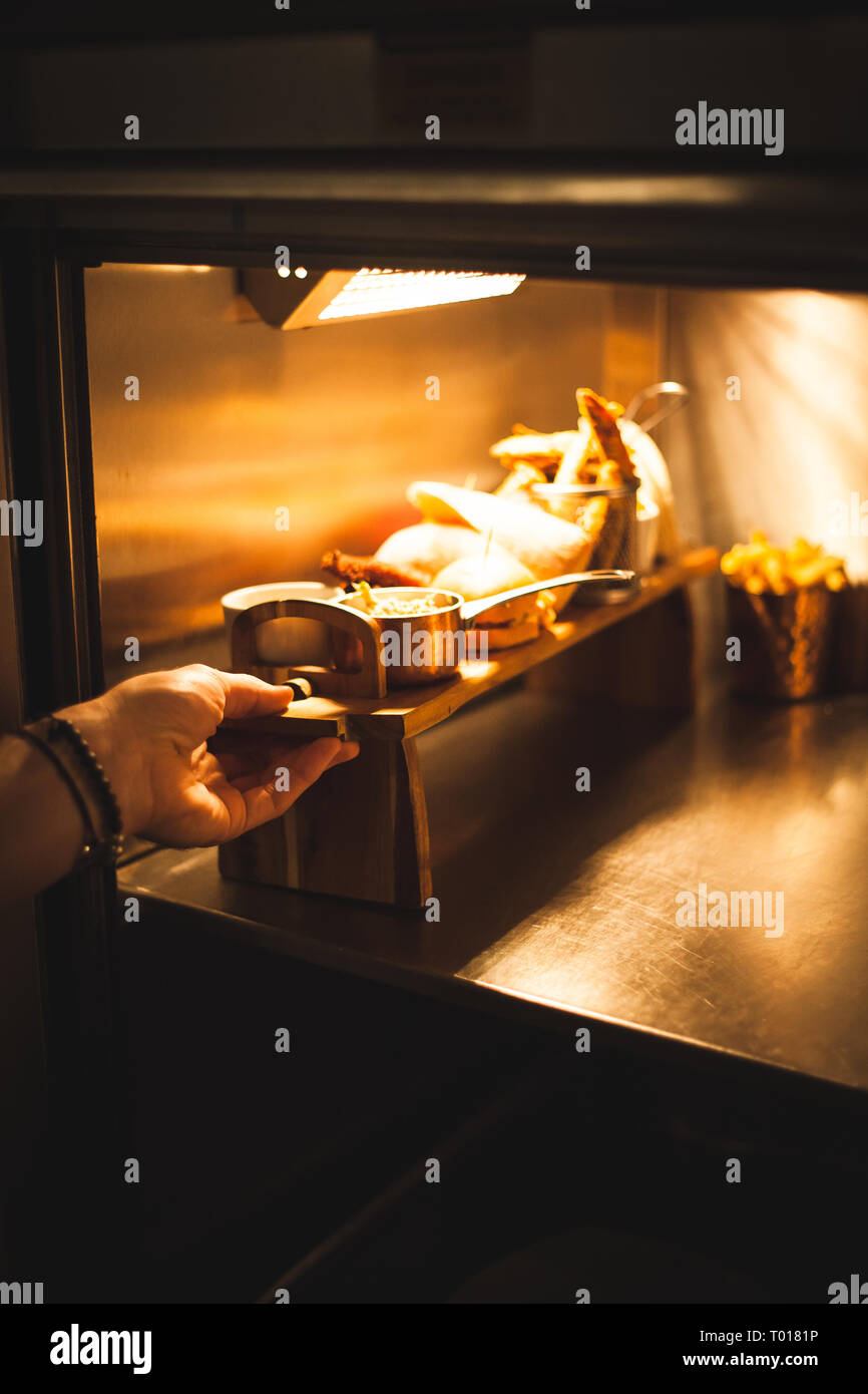 Heat lamp chef hi-res stock photography and images - Alamy