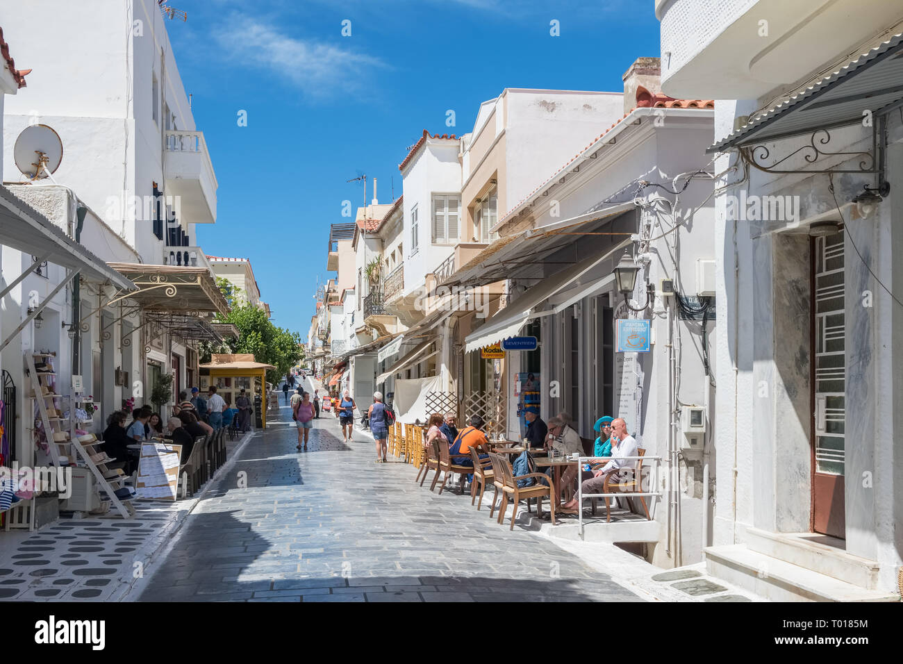 Andros, Greece - May 31, 2018: Main walking street with shops and cafes ...