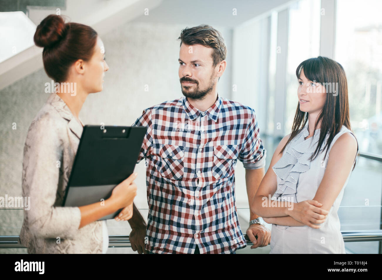 Young business people in informal chat Stock Photo - Alamy