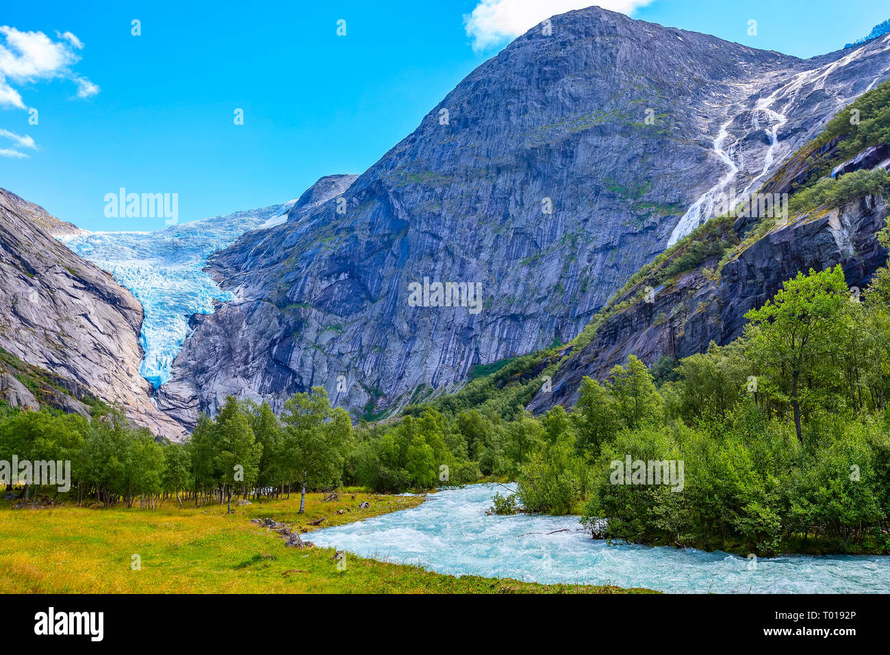 Briksdal or Briksdalsbreen glacier in Olden, Norway with green ...