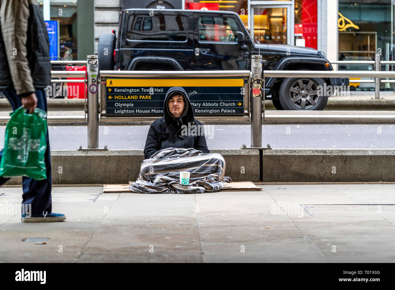 Invisible man. A young man, Connor, is homeless. He sits outside ...
