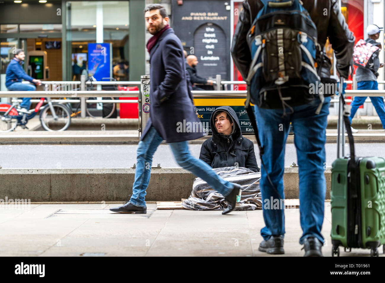 Invisible man. A young man, Connor, is homeless. He sits outside ...