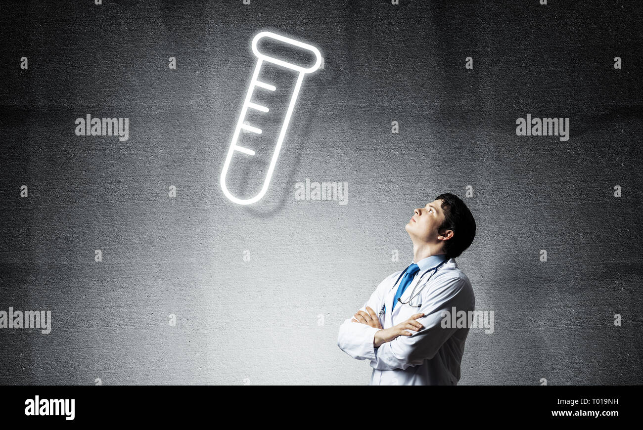 Doctor and vial symbol Stock Photo - Alamy