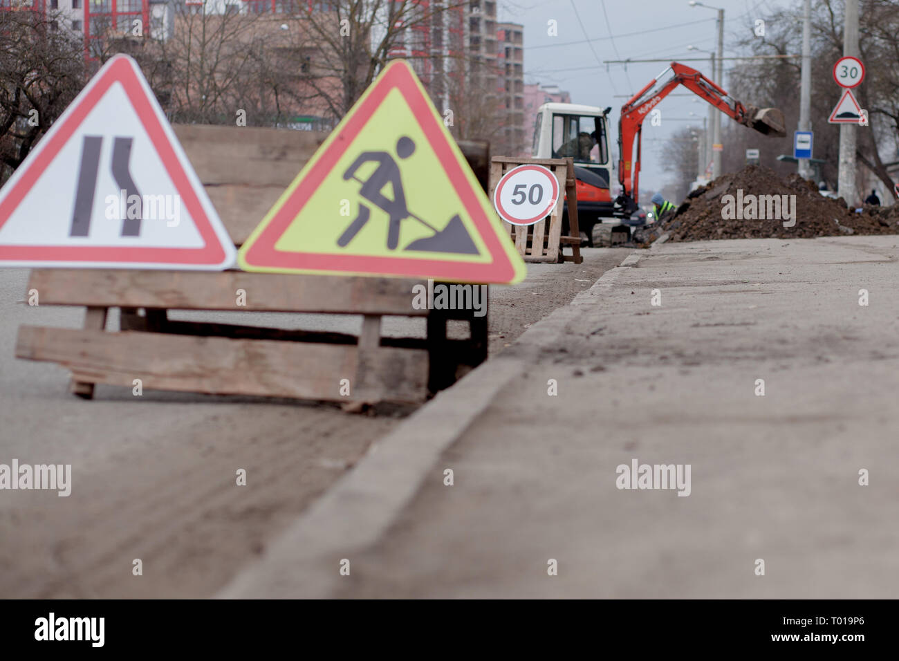 Road signs, detour, road repair on street background, truck and ...
