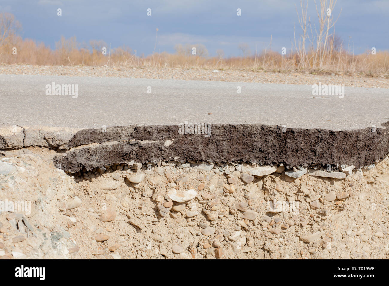 Cross section of asphalt road with blue sky background Stock Photo - Alamy
