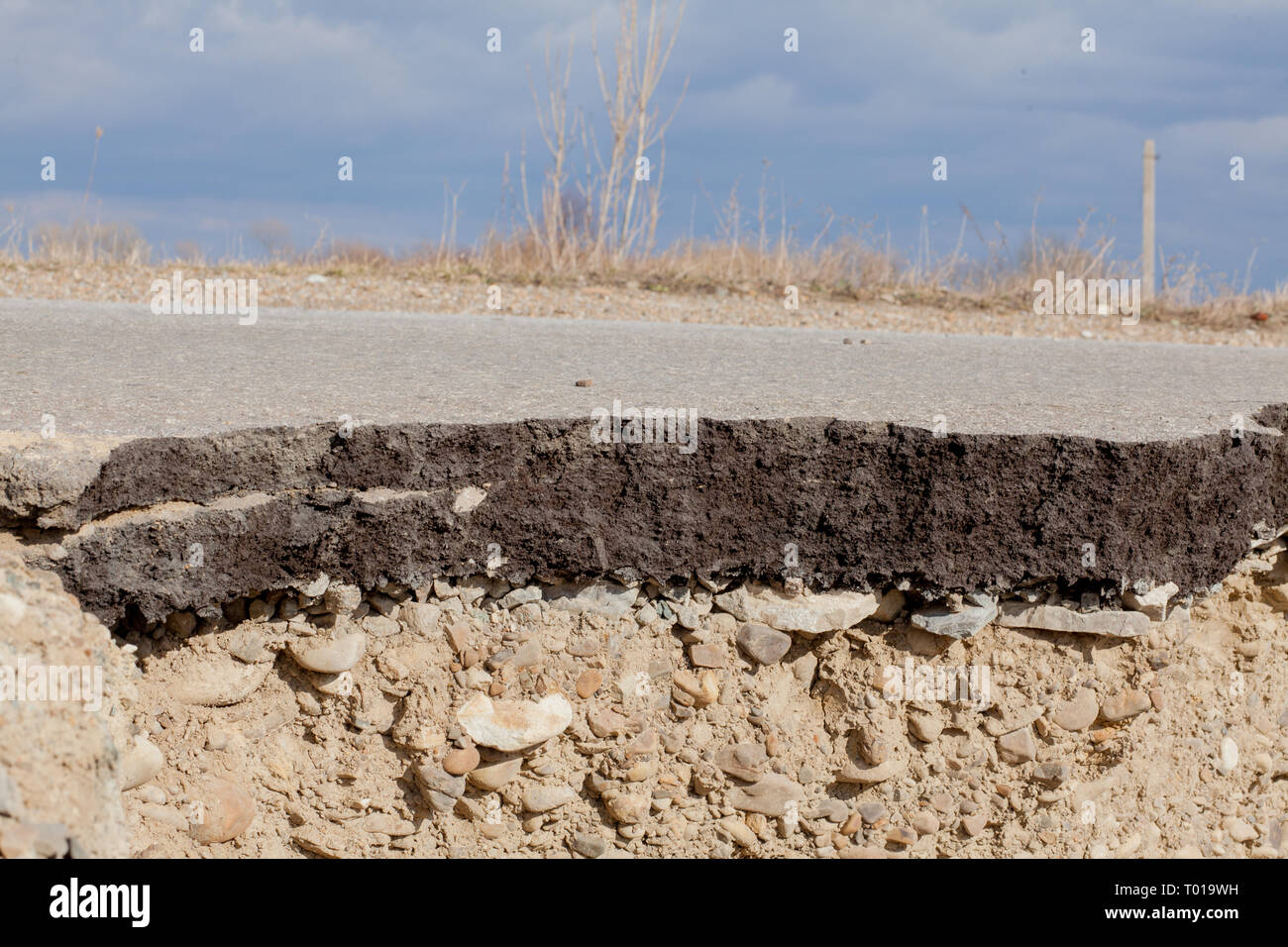 Cross section of asphalt road with blue sky background Stock Photo - Alamy