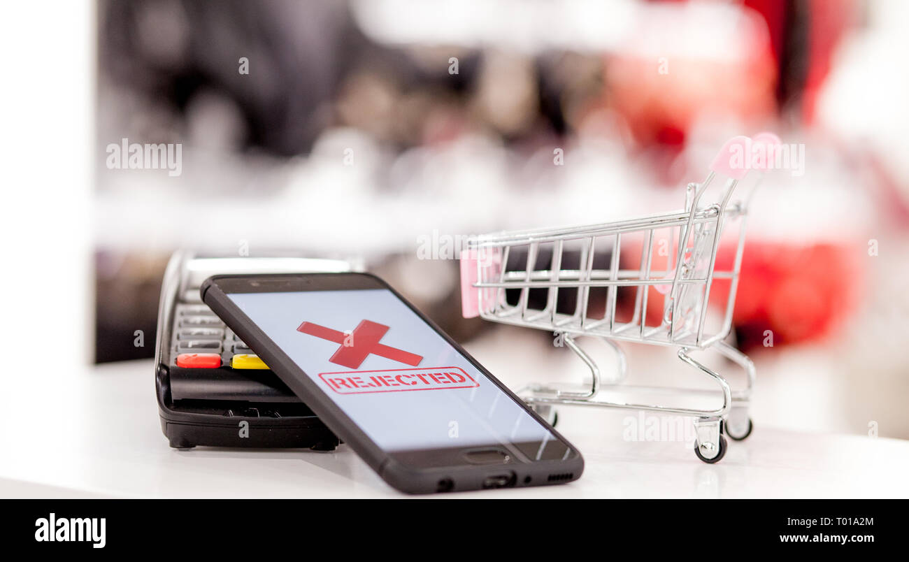 POS terminal, Payment Machine with mobile phone on store background ...