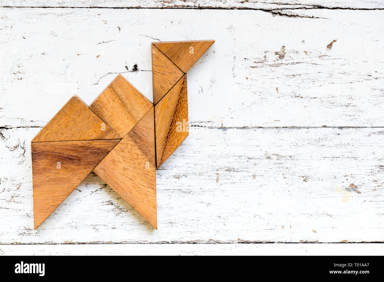 Tangram puzzle in camel shape on old white wood background Stock Photo ...