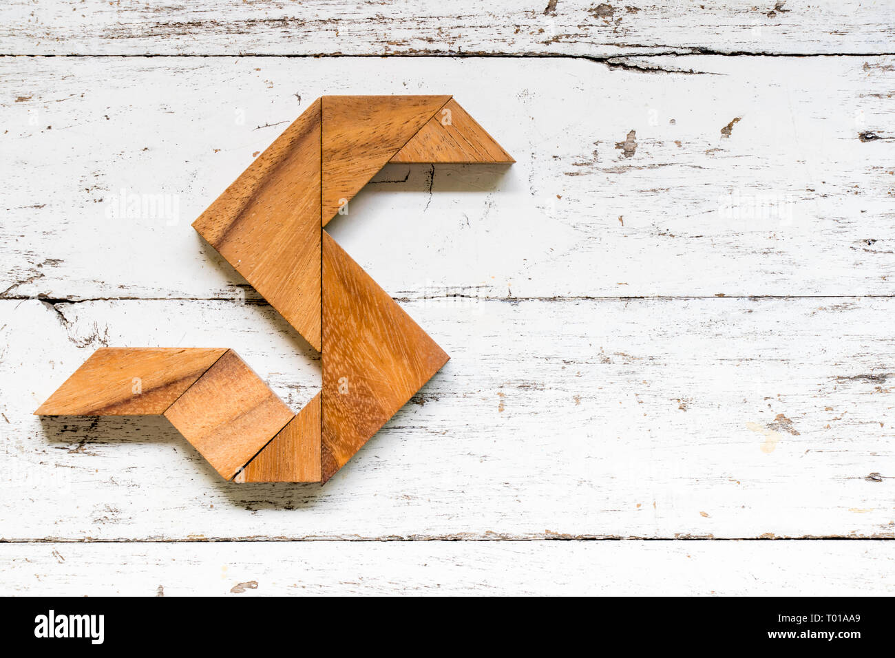 Wood tangram puzzle in sanke or dragon shape on white background Stock ...