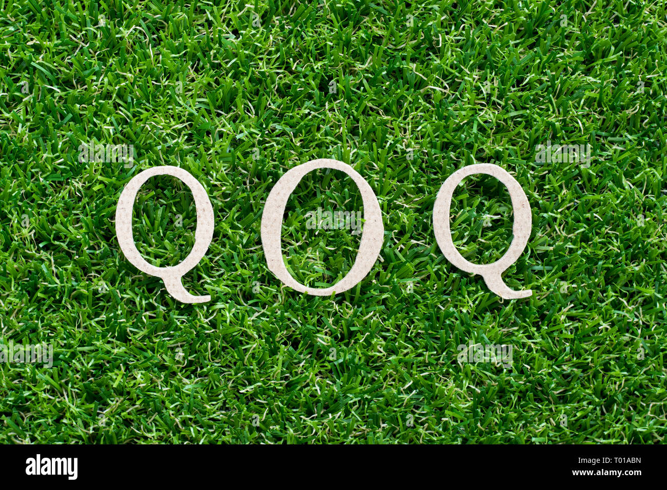 Wood alphabet in word QOQ (abbreviation of quarter on quarter) on ...