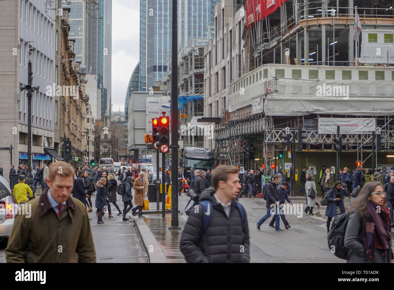 busy London street scene with pedestrians, construction, and high-rises ...