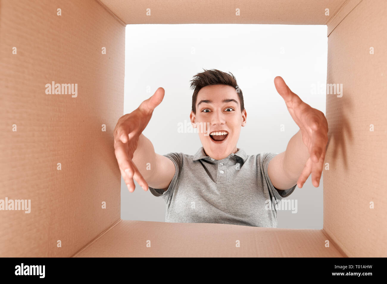 Boy opening box hi-res stock photography and images - Alamy