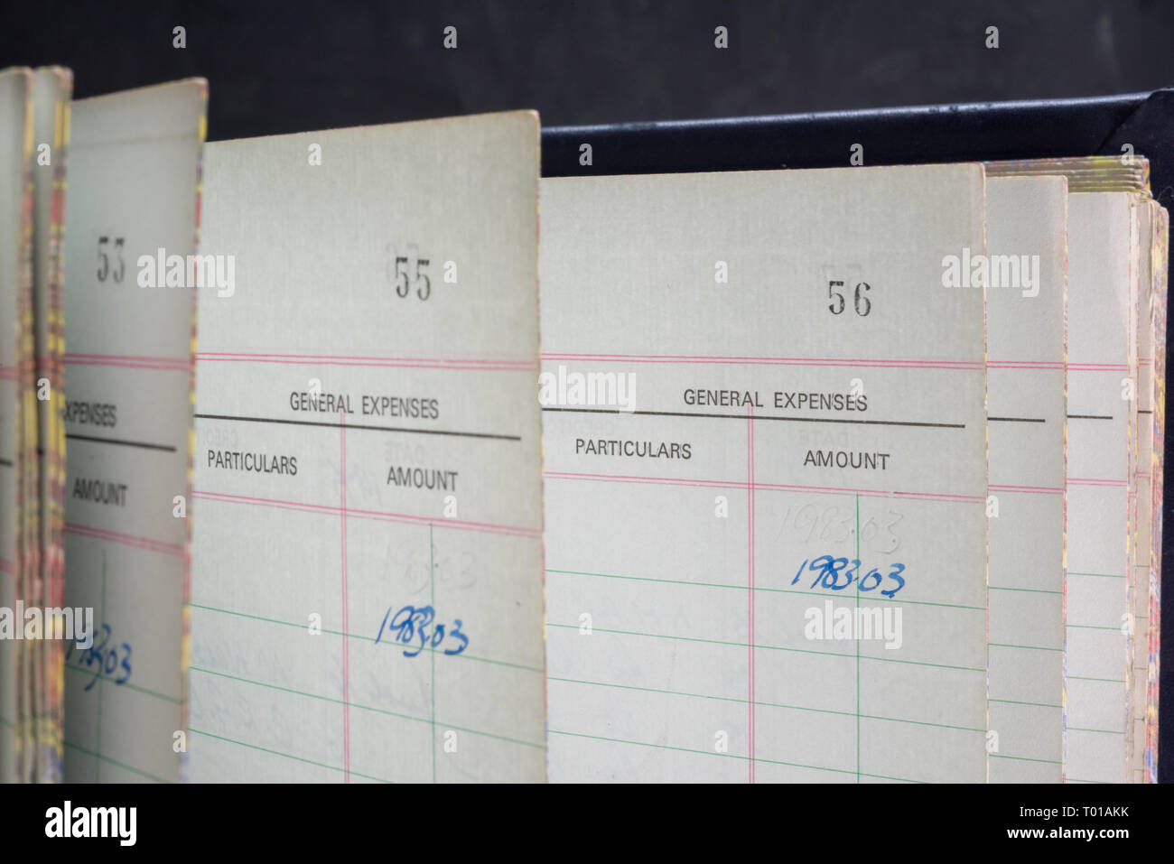 a close-up of handwritten accounting ledger pages dated 1975 Stock ...