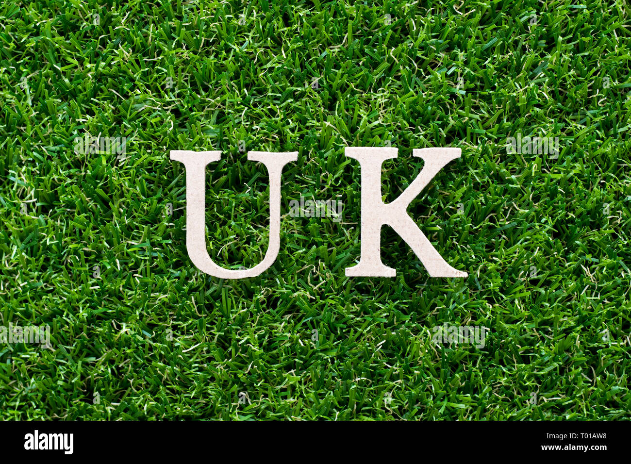 Wood letter in word UK (abbreviation of united kingdom) on artificial ...