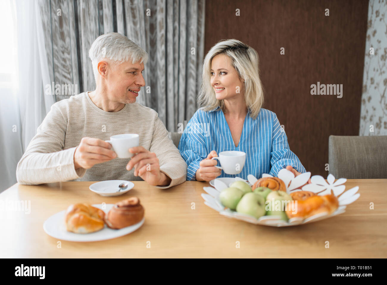 Breakfast of adult love couple at home Stock Photo - Alamy