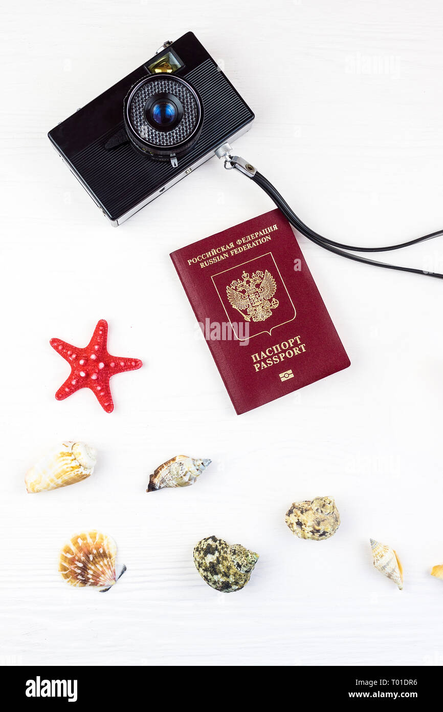 Seashells and camera on white background, passport, travel Stock Photo ...