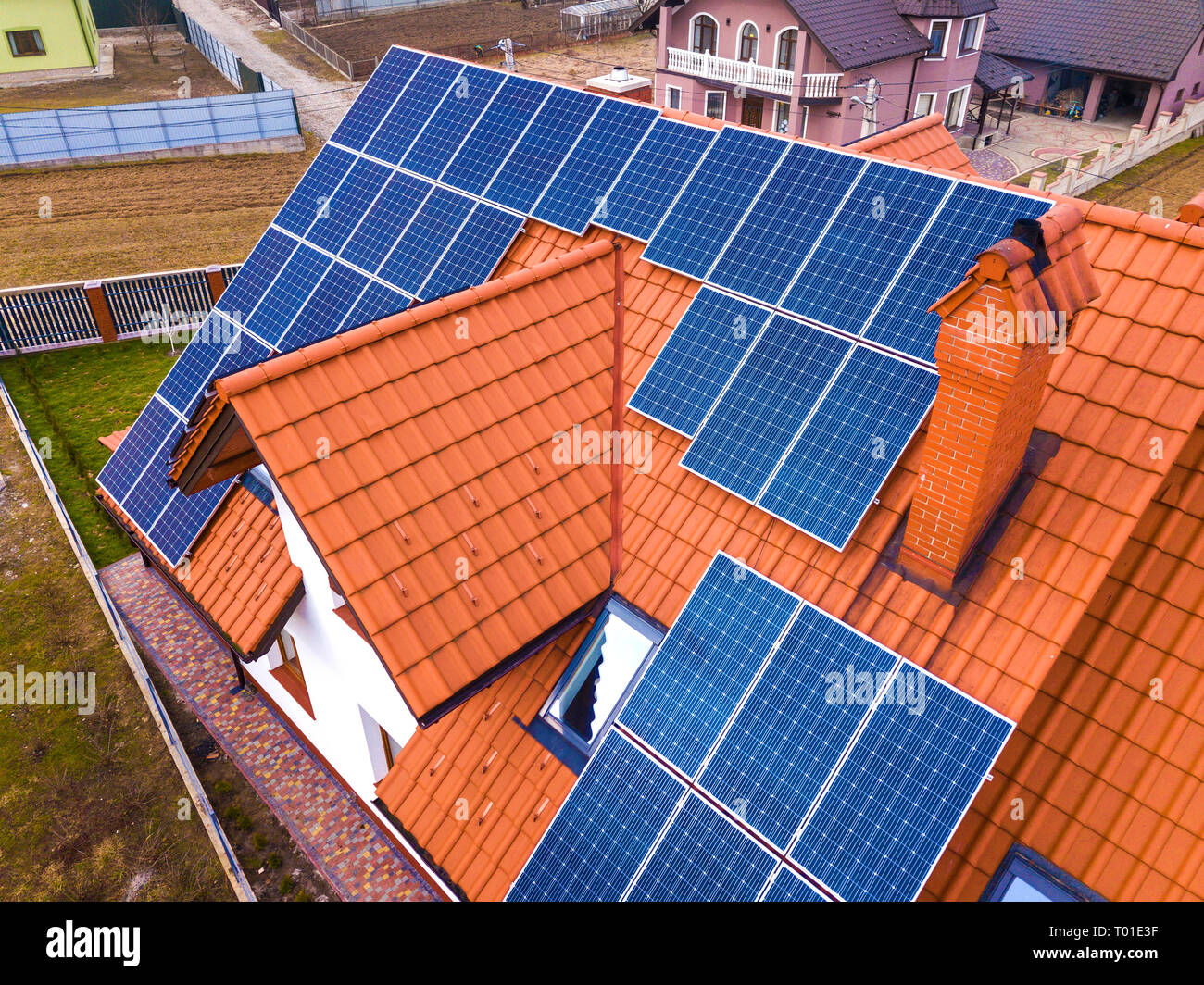 Aerial top view of new modern residential house cottage with blue shiny ...