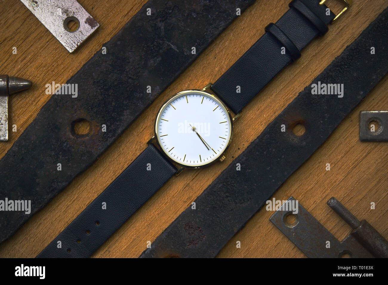 Wristwatch on wooden table from up top Stock Photo - Alamy