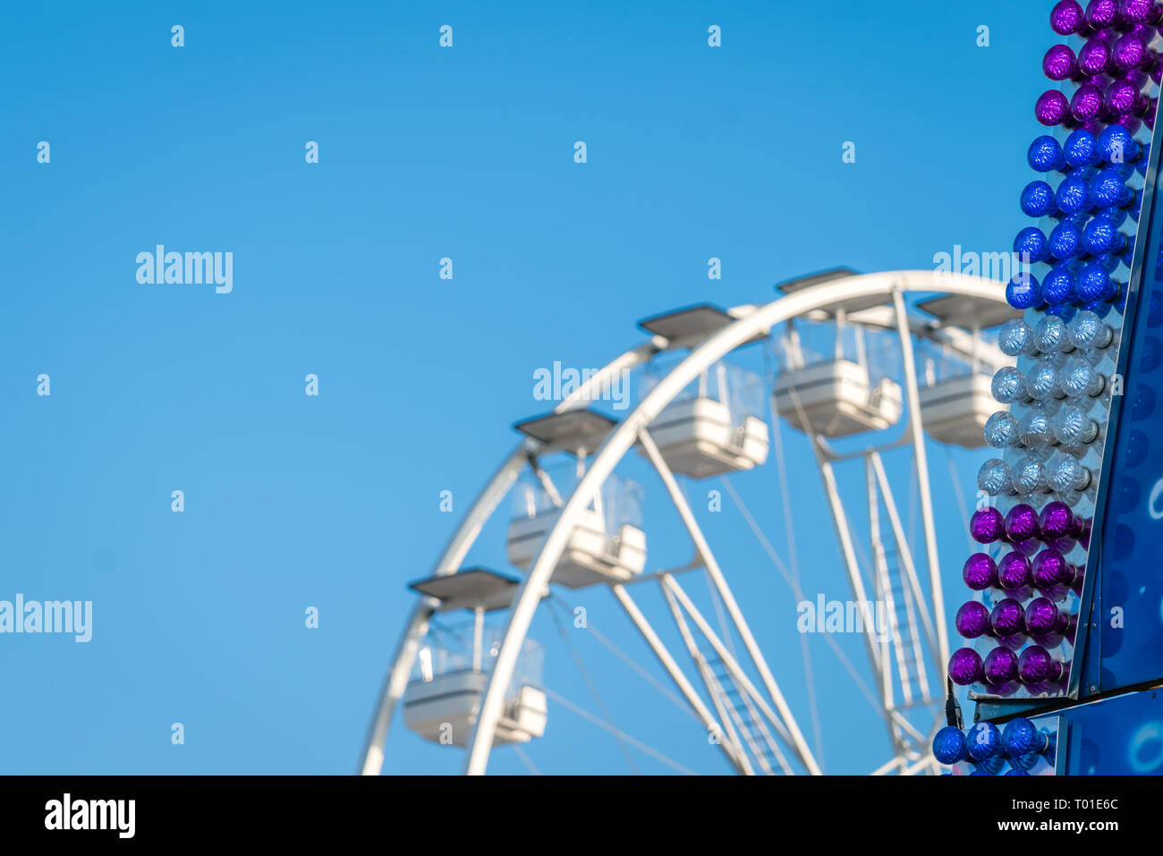 Amusement outdoor park carousel wheel detail against blue sky Stock ...