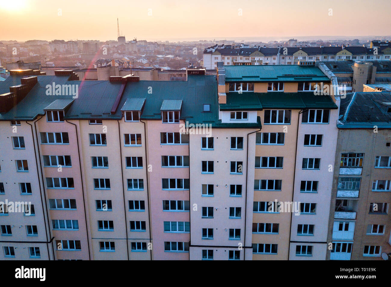 Aerial view of attic annex room exterior with plastic windows, roof and ...