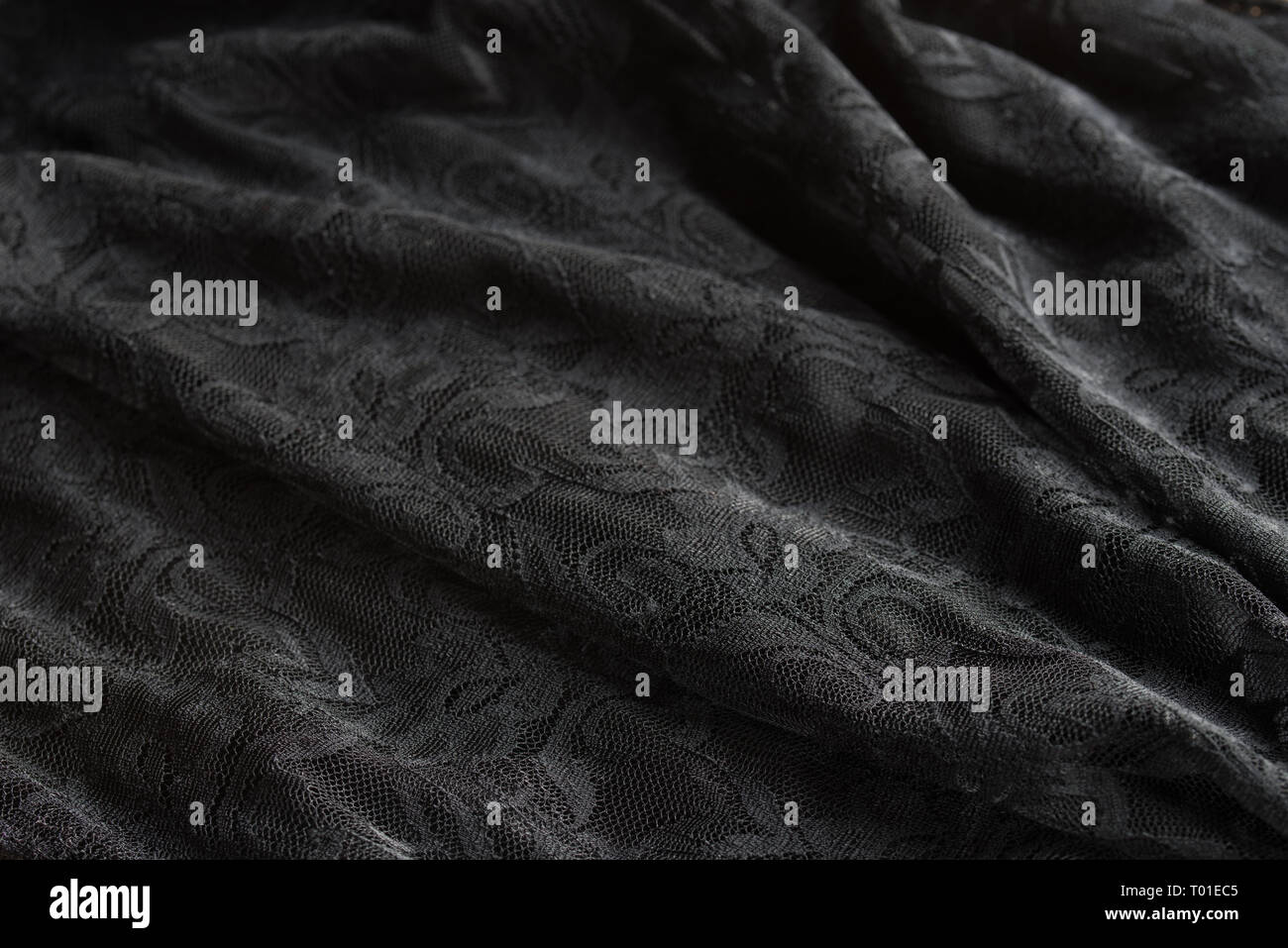 blackcolor folded lace textile background texture macro Stock Photo - Alamy