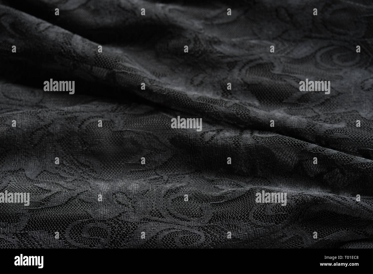 blackcolor folded lace textile background texture macro Stock Photo - Alamy
