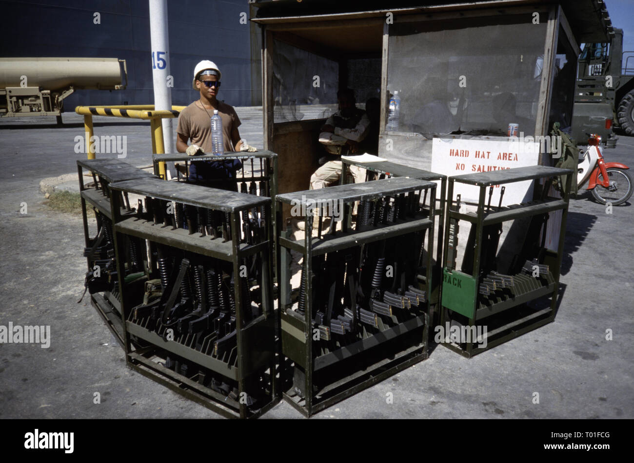 29th October 1993 Racks of M16 Carbines (rifles) being guarded where ...