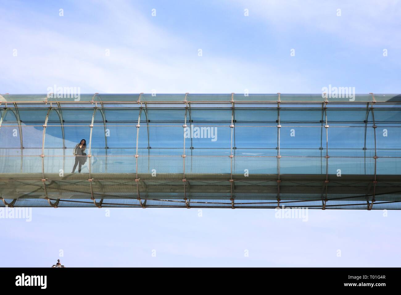 Connection between building by a tubular glass passage Stock Photo - Alamy