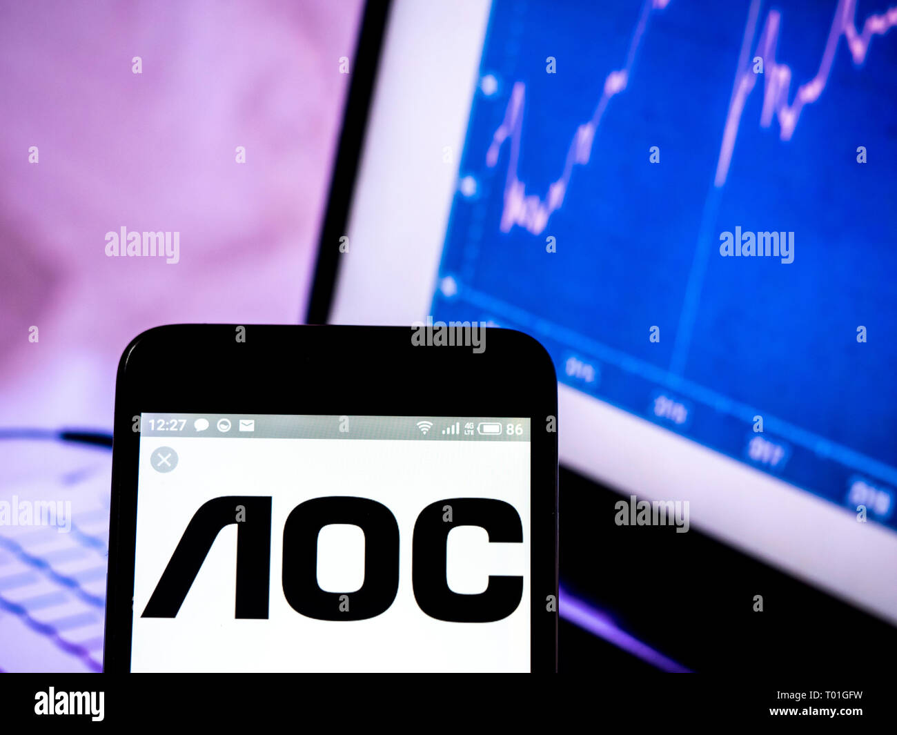 AOC Holdings logo seen displayed on smart phone Stock Photo - Alamy