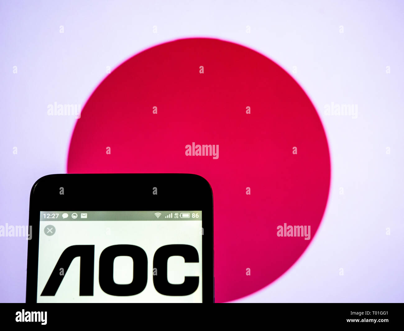 AOC Holdings logo seen displayed on smart phone Stock Photo - Alamy