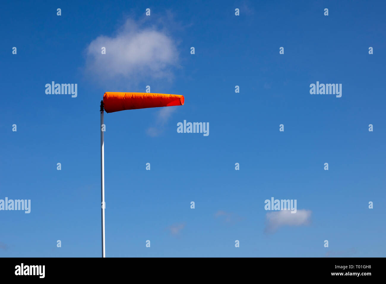 Airfield windsock, used to indicate wind speed and direction, shown ...