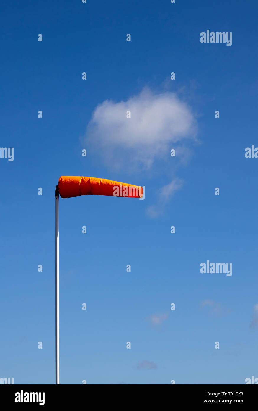 Airfield windsock, used to indicate wind speed and direction, shown ...