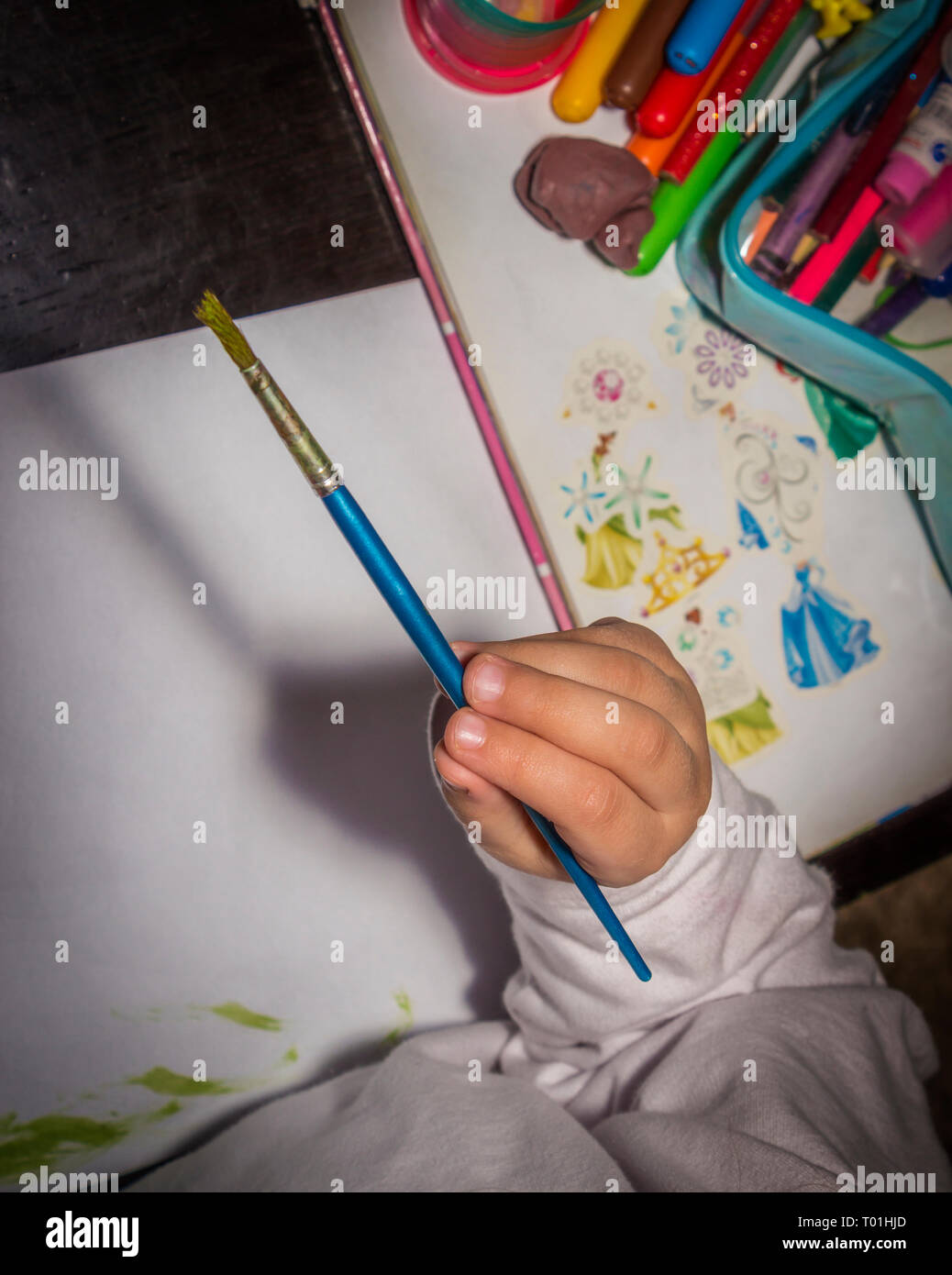 Kid playing with colors Stock Photo - Alamy