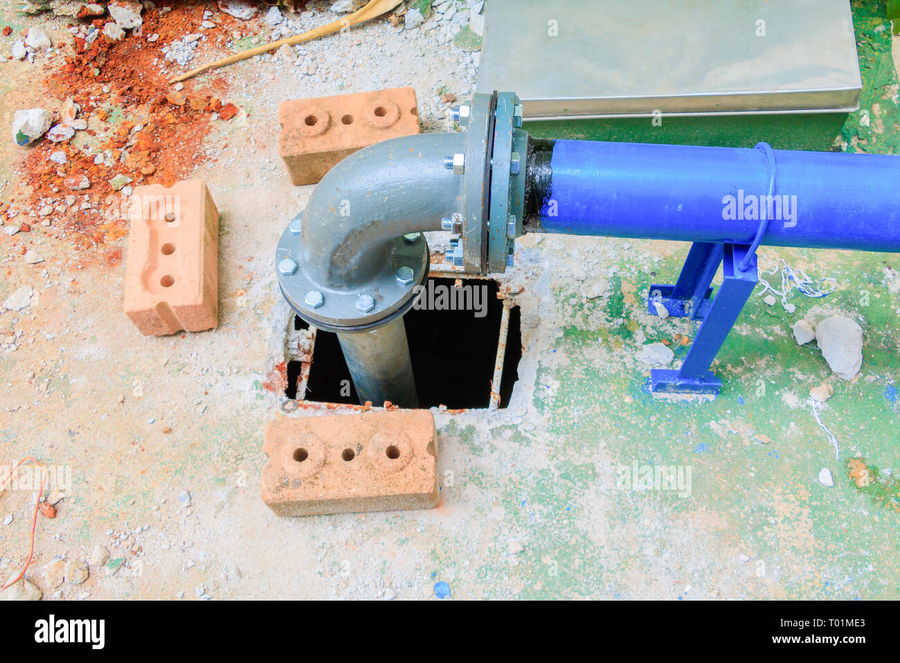 plumbing tube New repair On the hole cement floor Stock Photo - Alamy