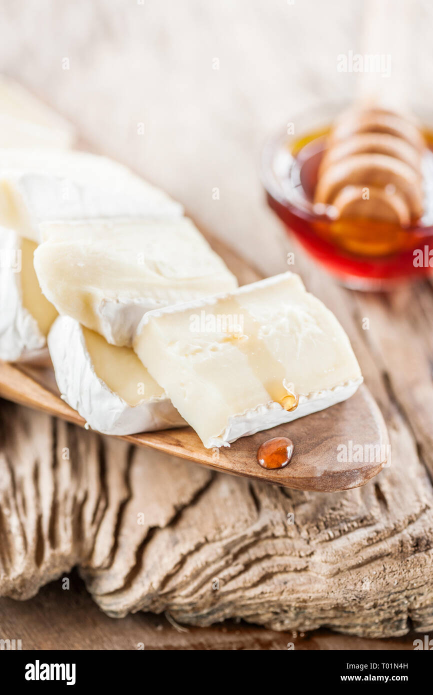 Baked camembert with honey on a beautiful old wooden background Stock ...