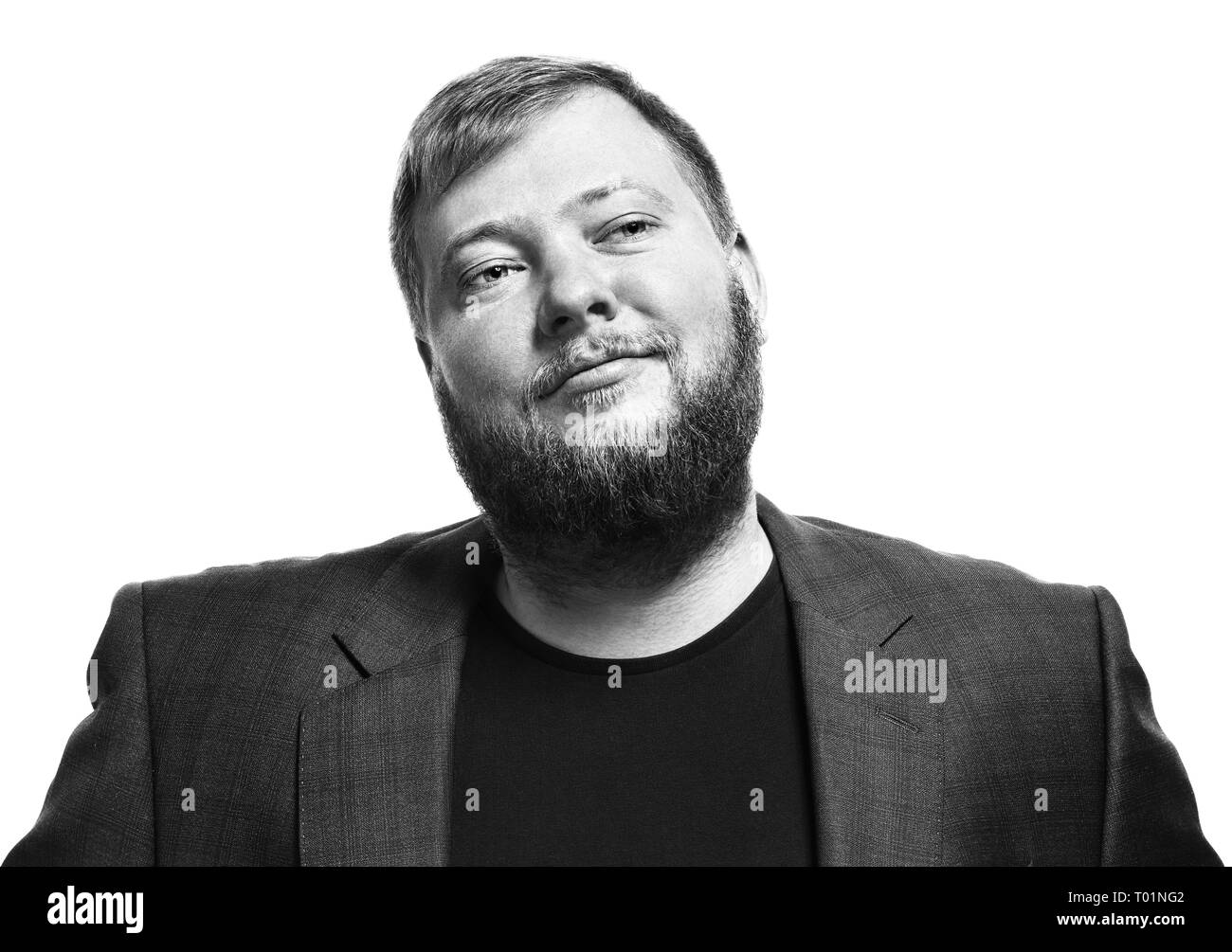 Close-up black and white portrait of a brooding bearded man. Blue ...