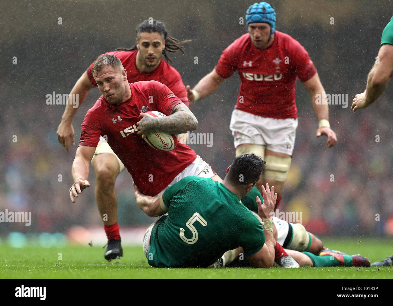 Ireland's James Ryan (centre) tackles Wales' Ross Moriarty (left ...
