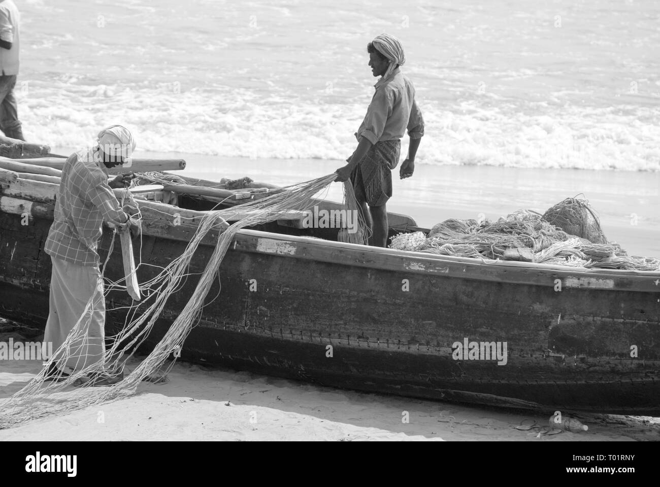 Rowing fishing boats in Black and White Stock Photos & Images - Alamy