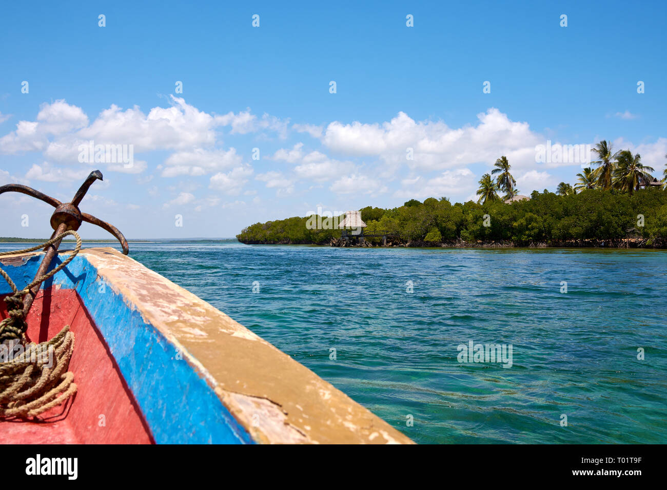 Tropical beach fishing boat palm hi-res stock photography and images ...