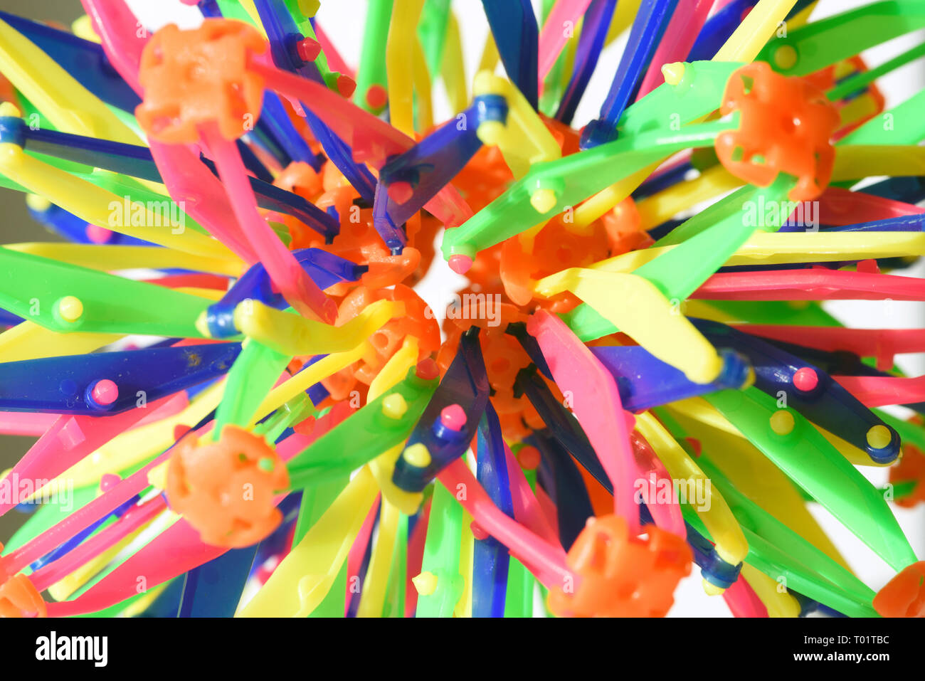 Multi-coloured pieces of bright plastic with shallow depth of field and ...