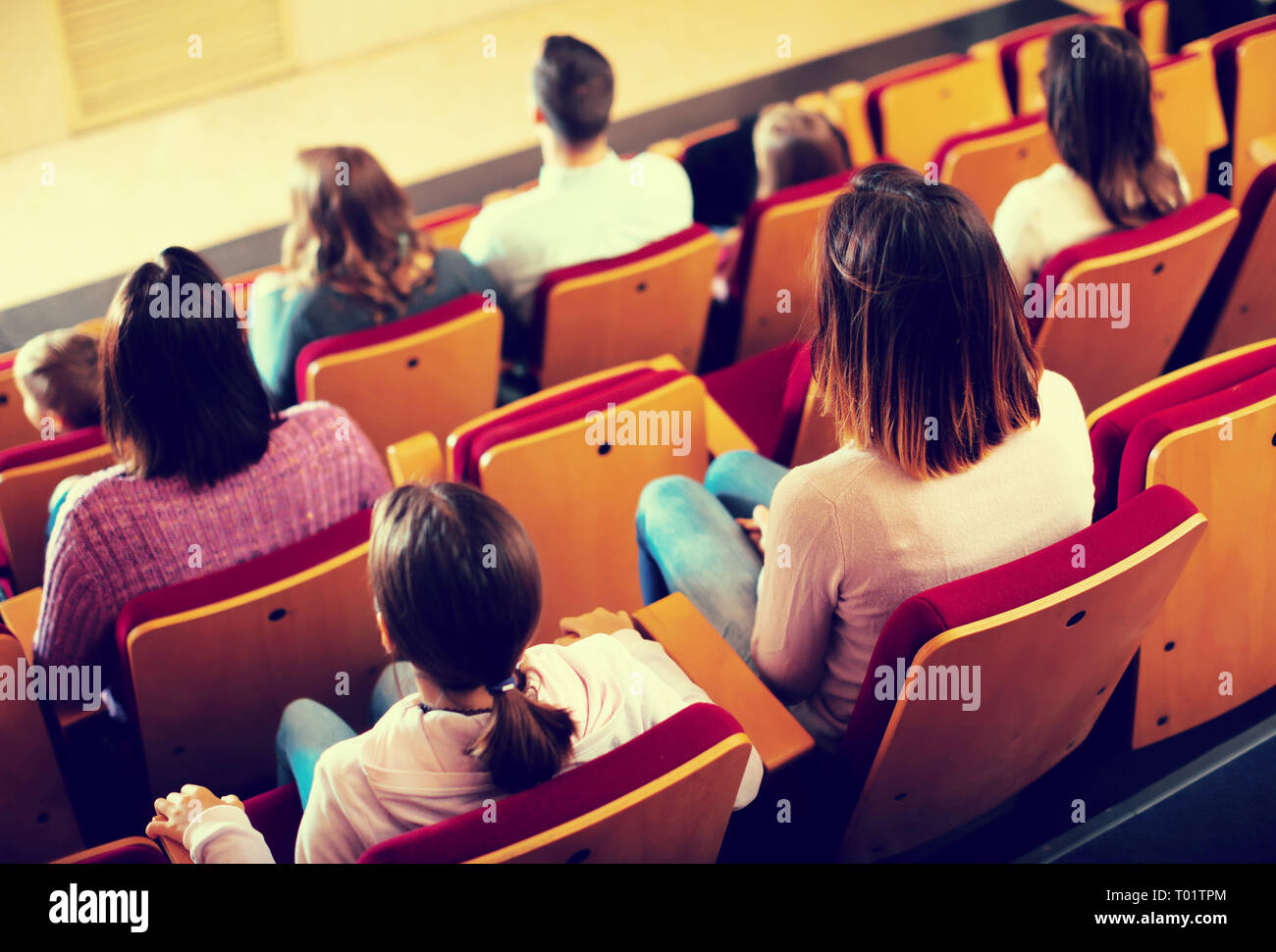 Ordinary audience expecting movie to begin in cinema Stock Photo - Alamy