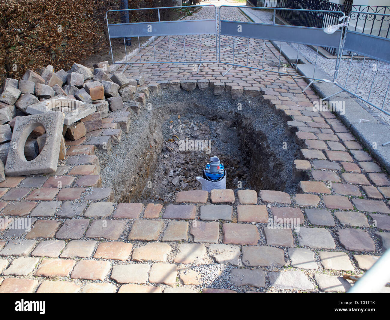 Hole in the pavement, repair of pipes. Roadblocks for safety Stock ...