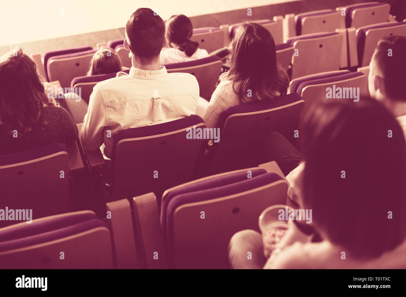 Young people waiting for comedy movie to start in cinema house Stock ...