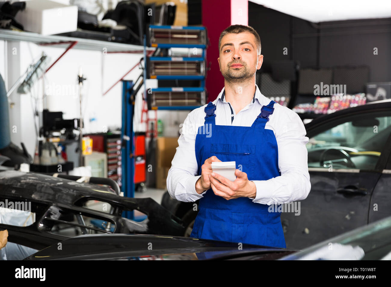 Professional auto mechanic recording hi-res stock photography and ...