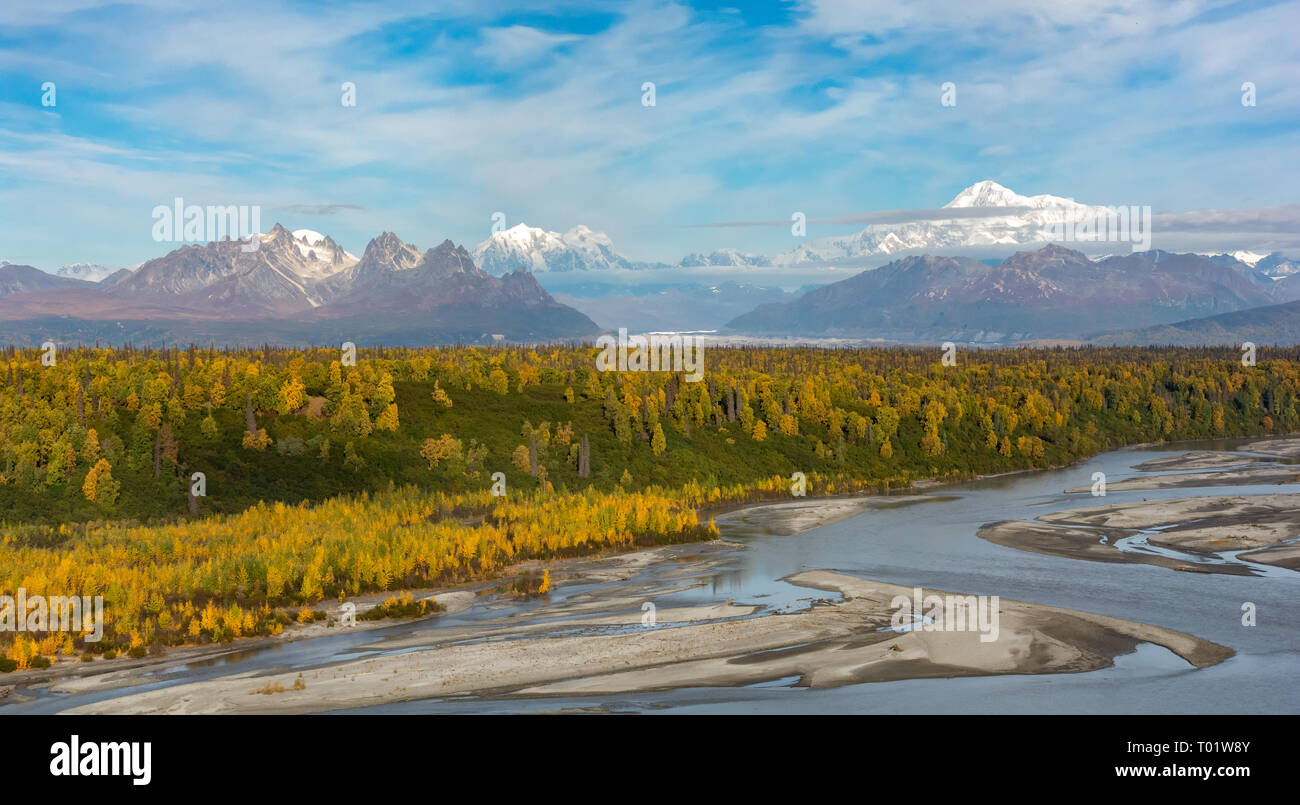 Water flows slowly through the braided gravel channels of the Chulitna ...