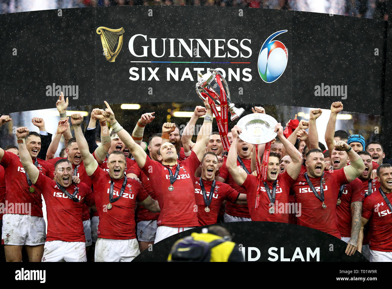 Wales lift the Six Nations Trophy and the Triple Crown trophy after the ...