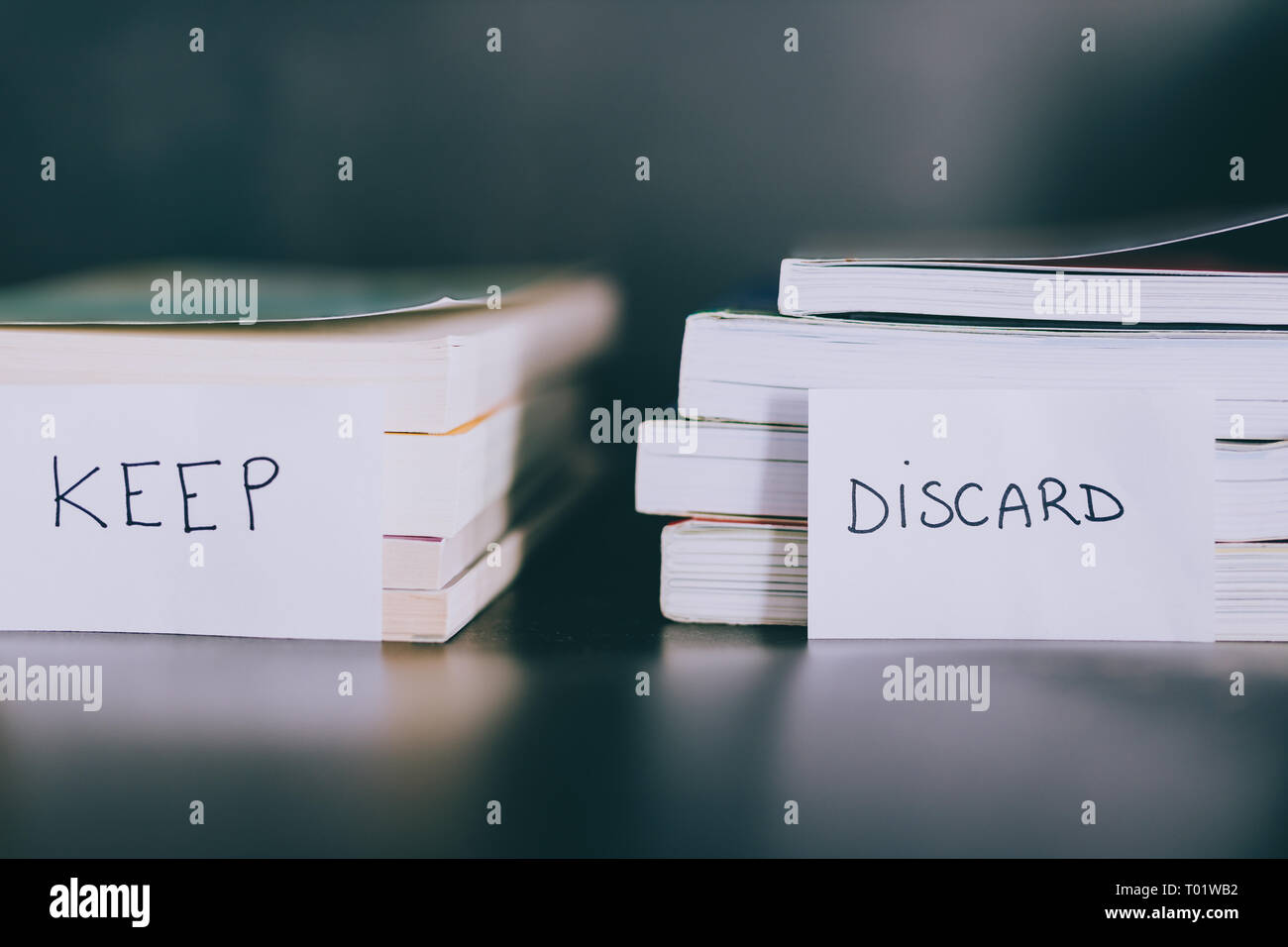 decluttering and tidying up concept: selecting which books to keep and ...