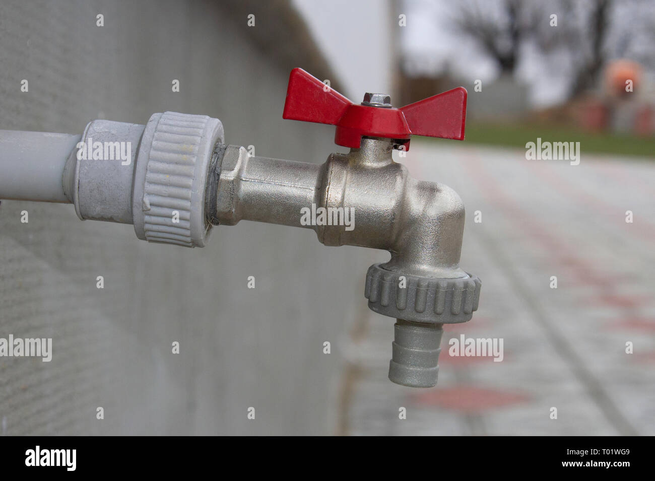 closed water tap on the wall outdoor Stock Photo - Alamy