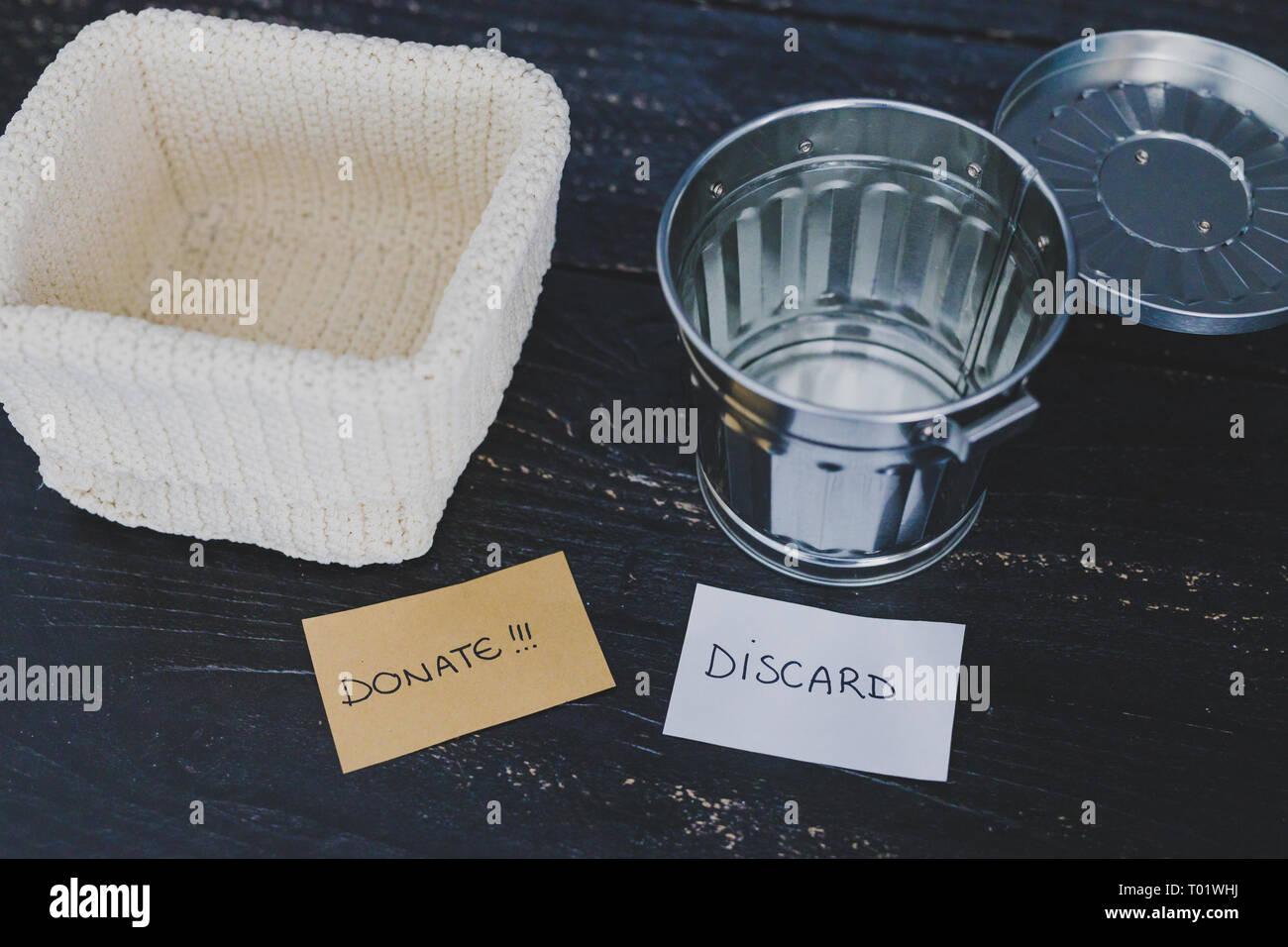 decluttering and tidying up concept: storage basket and gargabe bin to ...